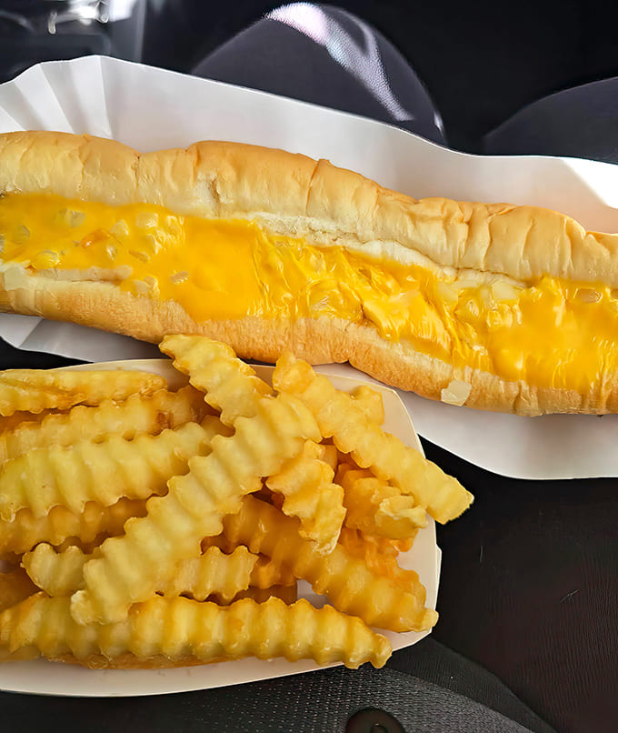 The foot-long challenge awaits brave appetites – this magnificent hot dog stretches the limits of both bun and belly in the most delicious way.