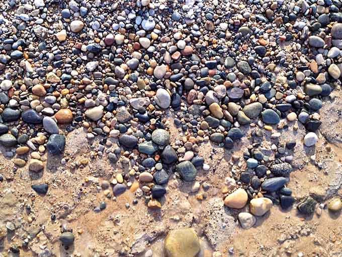 Nature's mosaic &ndash; smooth stones in a painter's palette of colors create a natural art installation along the shoreline.
