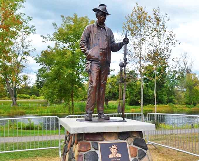 This bronze tribute to Fred Bear celebrates Michigan's archery legend and conservation champion.
