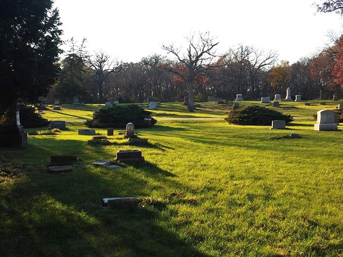 Morning light stretches across the peaceful grounds, casting long shadows that seem to connect the present with the past.