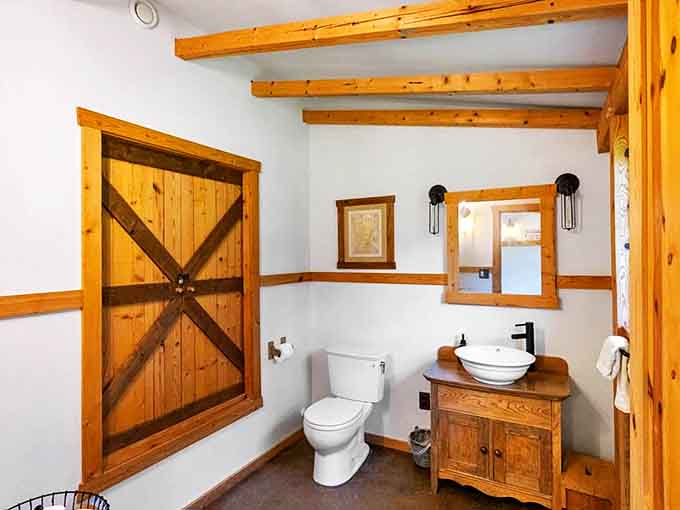 Even the powder room doesn't skimp on style – barn door details and thoughtful design make every corner of this home special.