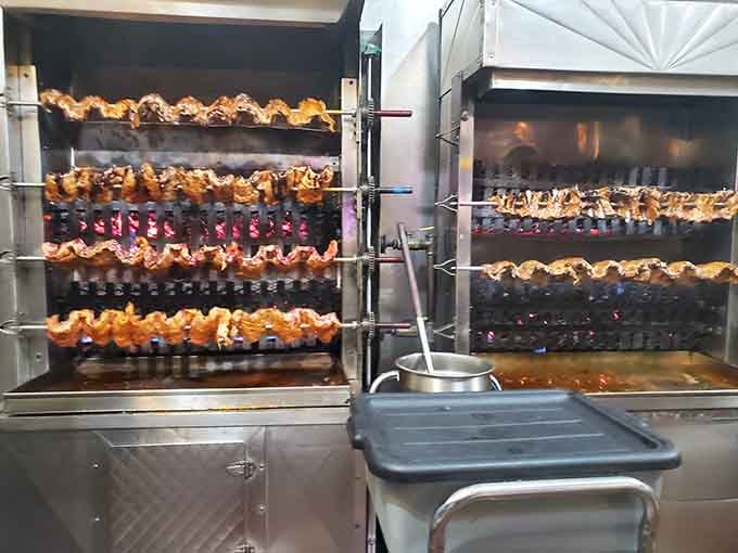 Those rotisseries spinning away like delicious Ferris wheels, turning chicken into something approaching art and perfection.