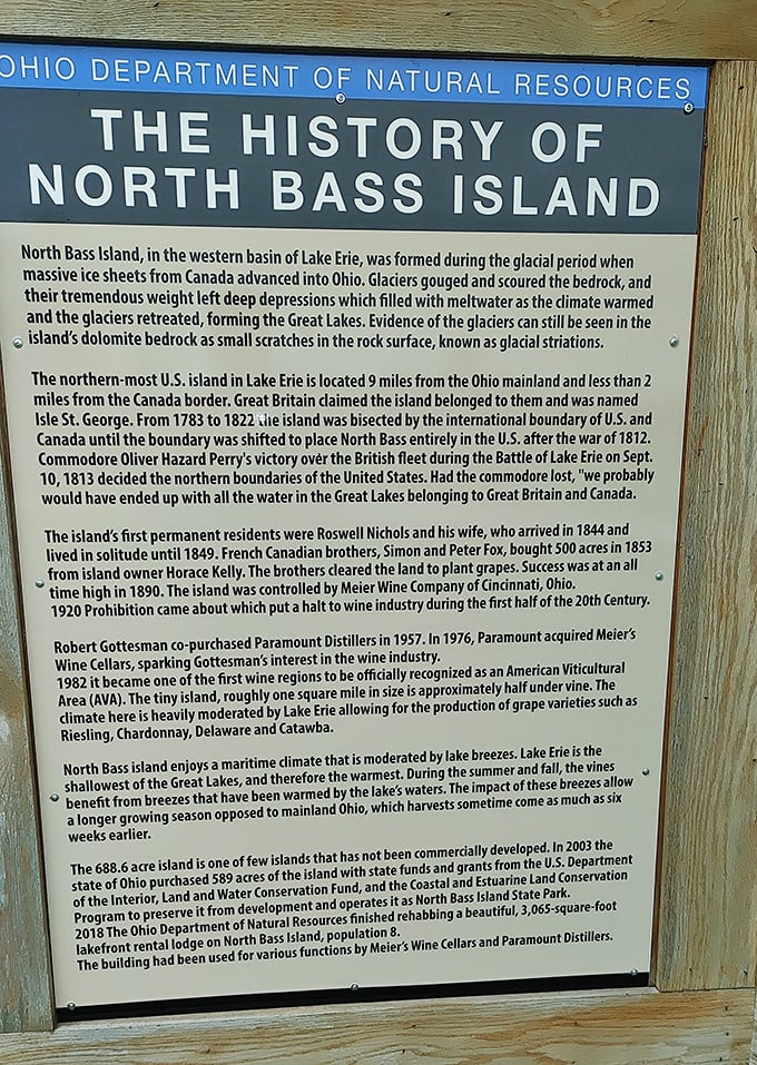 Historical marker explaining North Bass Island's past: History carved in stone – from glaciers to grapes, this island's story spans millennia.