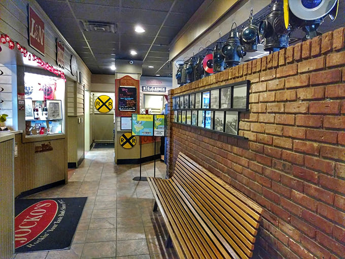 The entrance area sets the tone with train memorabilia and wooden benches that whisper of simpler, slower times.
