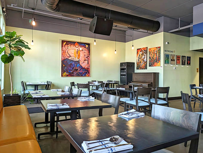 Colorful local artwork pops against soothing wall colors, creating a space that feels both energizing and relaxing at the same time.
