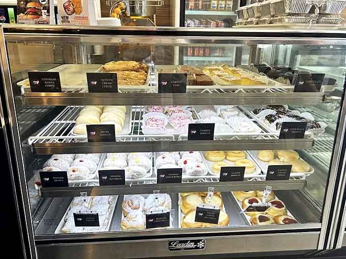 The display case &ndash; where diet resolutions go to die and "I'll just have one" becomes the day's biggest fiction.