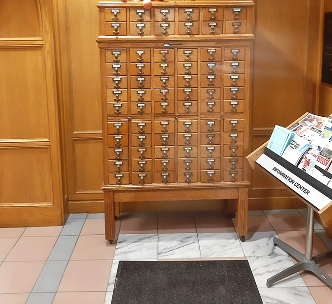 A vintage card catalog cabinet stands as a nostalgic reminder of how readers once discovered books before digital search systems.