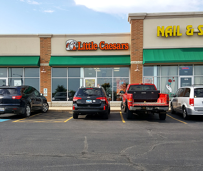 Even chain restaurants like Little Caesars somehow feel more connected to the community when they're nestled among locally-owned businesses on Main Street.