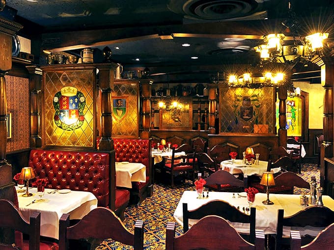 Rich wood, stained glass, and intimate lighting create dining nooks where conversations flow as freely as the wine recommendations.