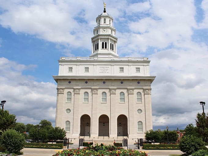 The Nauvoo Illinois Temple rises in gleaming white splendor, its architecture a testament to faith and craftsmanship that transcends religious boundaries.