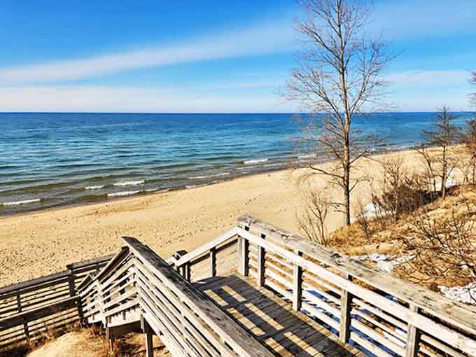 Lake Michigan's sandy shores offer a freshwater ocean experience, where footprints disappear with each gentle wave's caress.