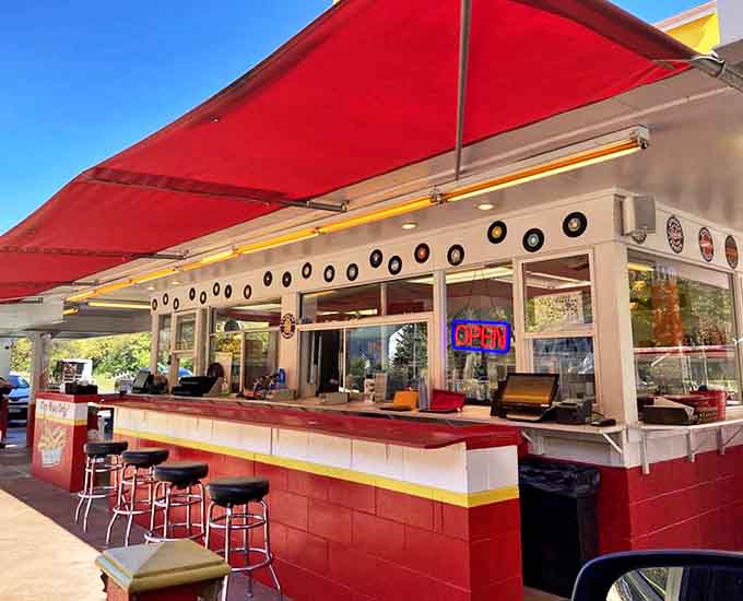 Another angle of Earl's reveals the clean, classic lines of this culinary institution where "TURN YOUR LIGHTS ON" has guided hungry patrons for decades.