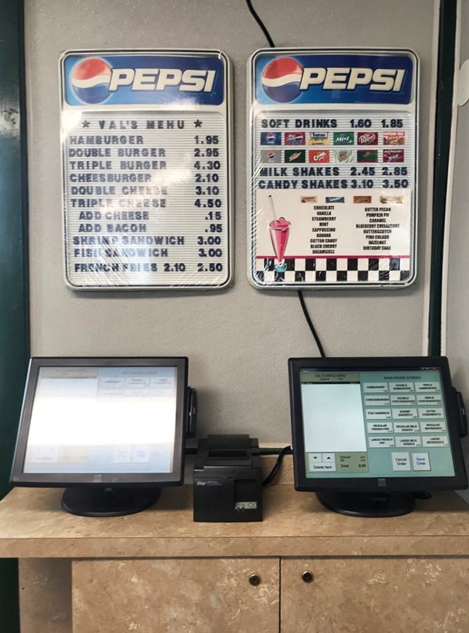 The weathered Pepsi menu board, a testament to Val's enduring presence in the community through changing times.