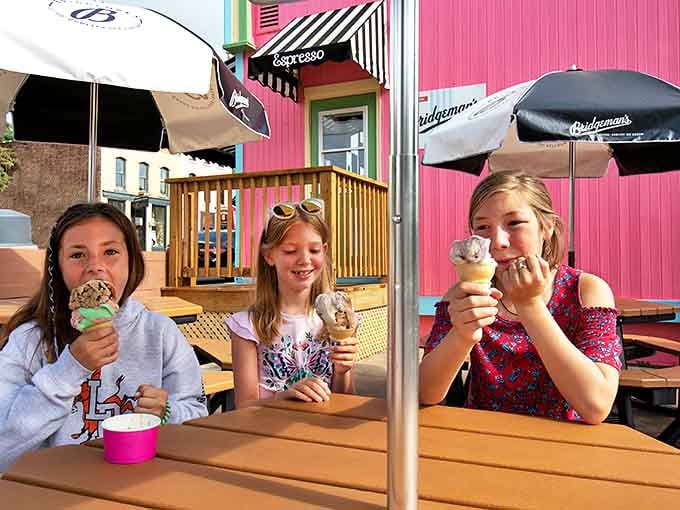 Outdoor tables where ice cream becomes an event rather than just a treat, with the pink building providing the perfect backdrop.