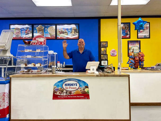 The welcoming wave from behind the counter sets the tone for every visit, where genuine hospitality makes choosing ice cream feel like catching up with friends.