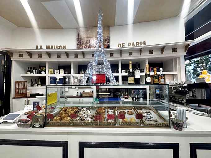The Eiffel Tower stands guard over a kingdom of pastries – a glittering reminder that you're about to eat something authentically French.