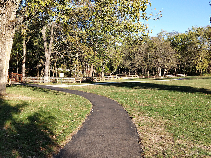 A gentle pathway guides visitors through sun-dappled woods. Nature's version of the yellow brick road, minus the flying monkeys.