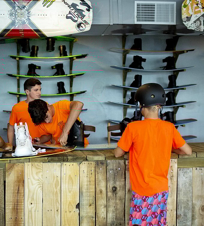Equipment central: Young adventurers get fitted with the proper gear, transforming from ordinary visitors into wakeboarding warriors ready for action.