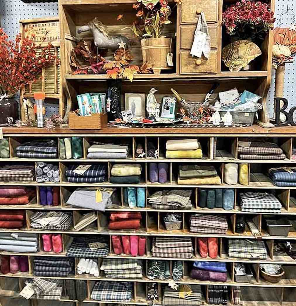 The fabric section organizes textile history by the square foot – plaids, checks and solids that once dressed generations now await creative new purposes.