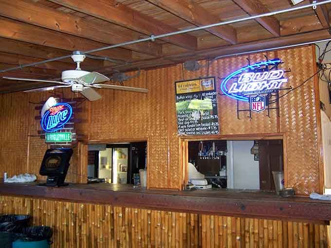 Neon signs and well-stocked shelves create that timeless bar atmosphere where good times and cold beers flow with equal abundance.