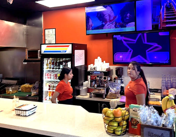 Behind this counter, skilled hands craft sandwiches that have earned worldwide fame and countless devoted fans.