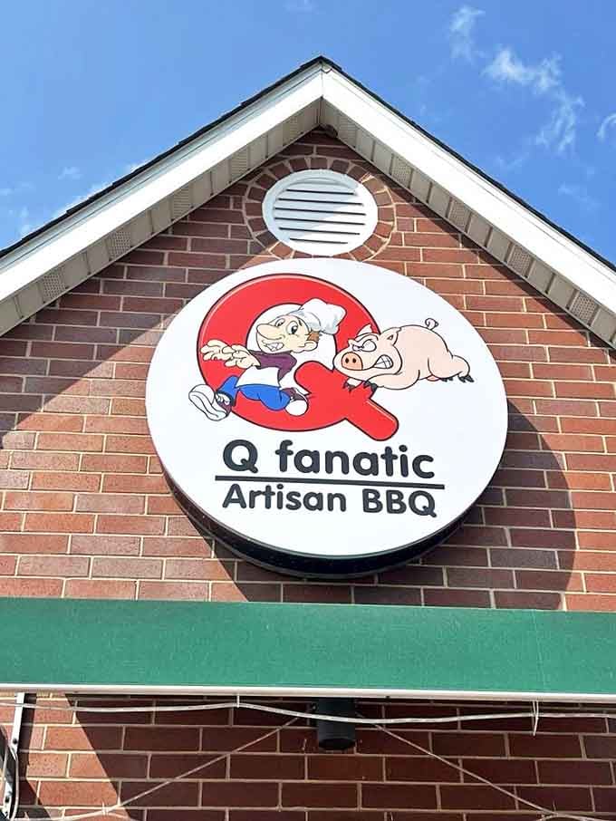 The Q Fanatic logo featuring a chef and pig, a whimsical herald of the serious barbecue artistry waiting inside.