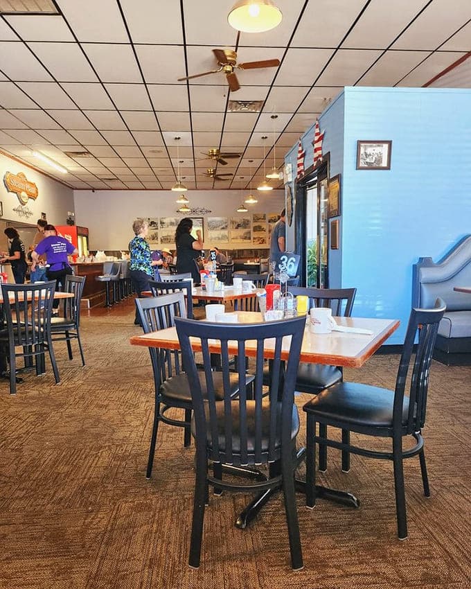Another angle of the dining room reveals the comfortable booths and vintage decor that make this feel like a neighborhood spot even if you're visiting from out of town.