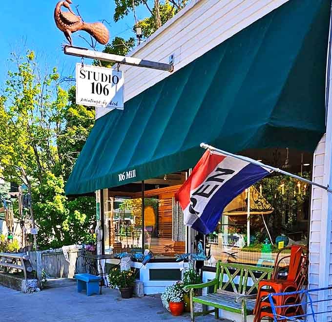 Studio 106 showcases local creativity beneath its distinctive green awning, where art captures Northport's beauty through many eyes.