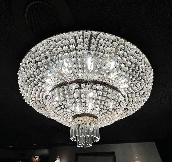 This crystal chandelier has illuminated countless celebrations, its sparkling presence adding a touch of elegance to the historic dining experience.