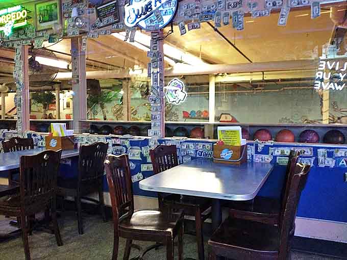 Every inch tells a story in this burger shrine, where bowling trophies and memorabilia create a museum of local flavor.