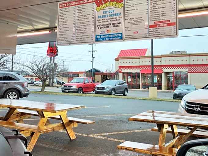 The drive-in area maintains its mid-century charm, where cars line up for service just as they have for generations.