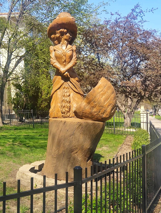 This wooden sculpture adds artistic whimsy to Summit Avenue's historical landscape – proof that even the street's decorations have personality.