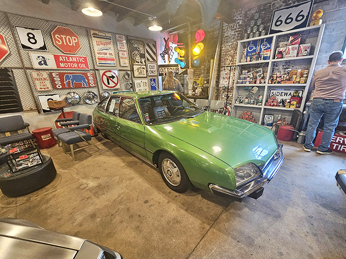 Classic cars tucked among vintage signs &ndash; this green beauty has probably seen more American history than most history textbooks cover.