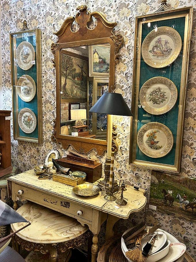 Ornate mirrors and carefully curated wall displays show how vintage pieces can transform blank walls into captivating focal points instantly.