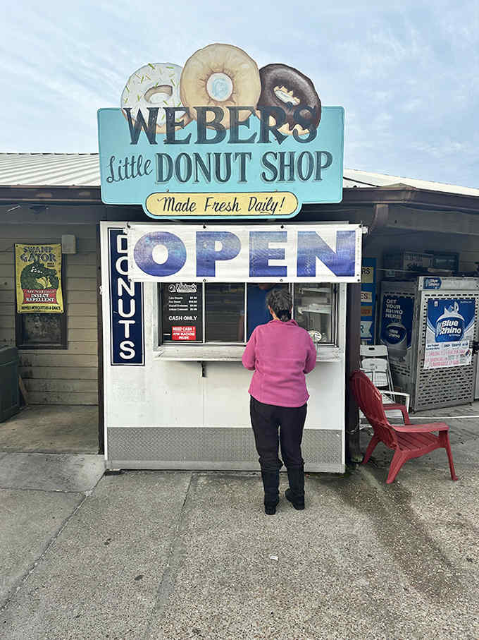 The iconic storefront beckons with its retro sign and simple promise: exceptional donuts await those willing to rise early and stand in line.