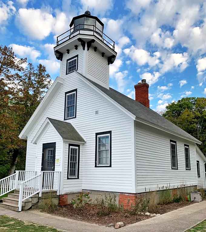 Against azure skies, the lighthouse's crisp angles and classic proportions demonstrate why this architectural style has endured for centuries.