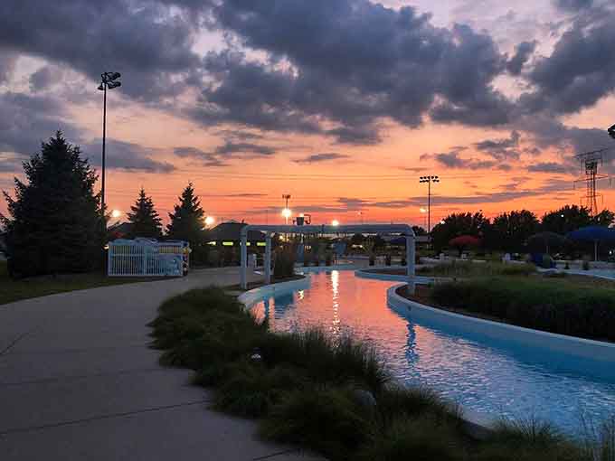 Sunset turns the lazy river into liquid gold, proving that even water parks have their poetic moments.