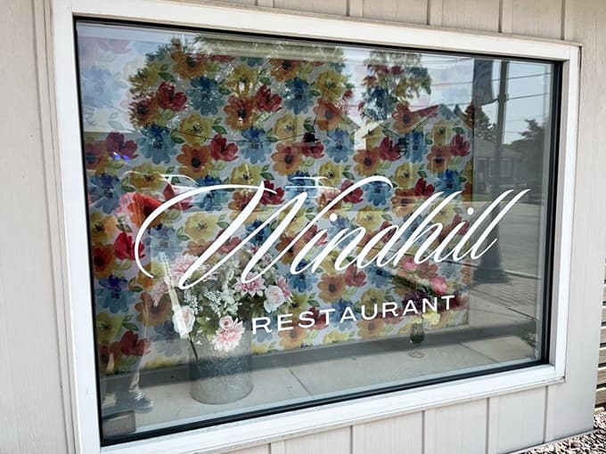 The window decoration showcases the restaurant's whimsical personality, inviting passersby to step inside and discover what all the fuss is about.