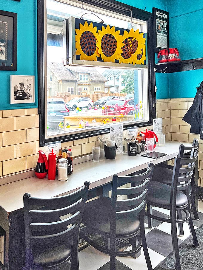 Sunflowers brighten the window seating area, where lucky diners can people-watch between bites of breakfast perfection.