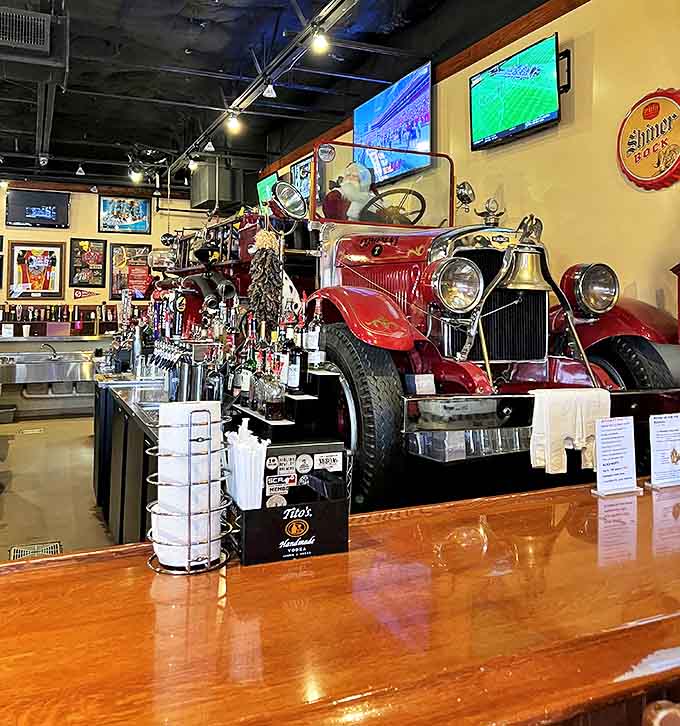 The antique fire engine bar centerpiece isn't just decoration &ndash; it's a genuine piece of history serving as the heart of this themed eatery.