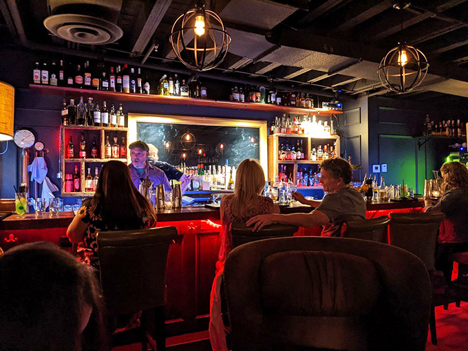 The bar glows like a beacon of hope in a dry county – bottles arranged with museum-like precision await their moment.