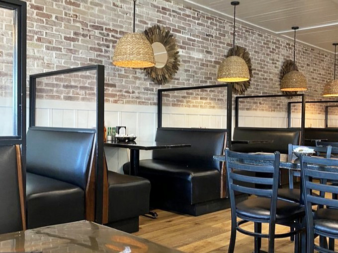 Booth seating offers semi-private dining nooks &ndash; perfect for everything from first dates to family gatherings where conversation flows as easily as the iced tea.