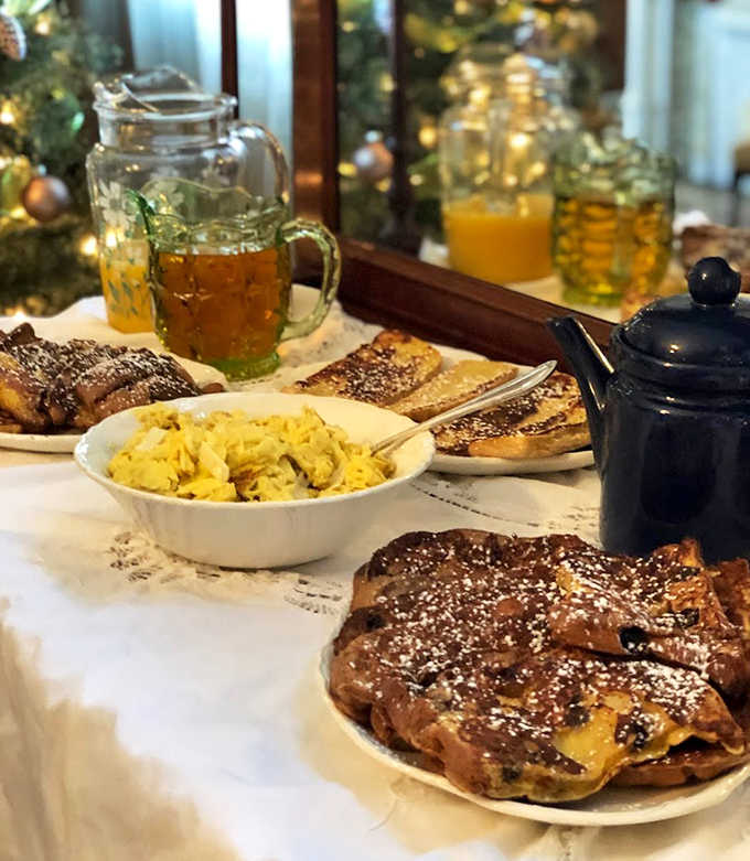 Breakfast fit for royalty: French toast, scrambled eggs, and fresh-baked pastries await morning guests in this sunlit dining room.