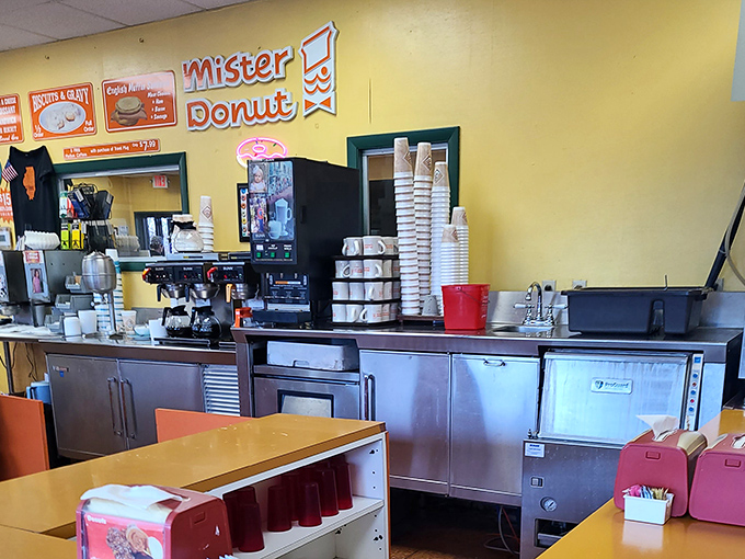 Behind the counter where the magic happens – equipment that's served faithfully for decades, producing consistent excellence every morning.