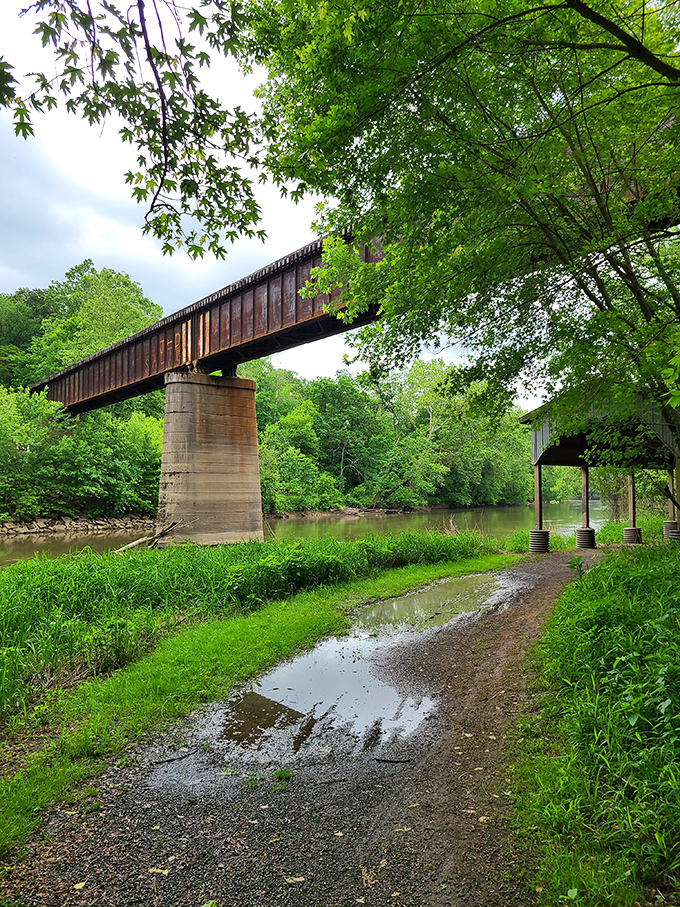 The iron truss bridge spans the Tuscarawas River, which once brought canal boats laden with visitors and trade goods to this remote religious community.