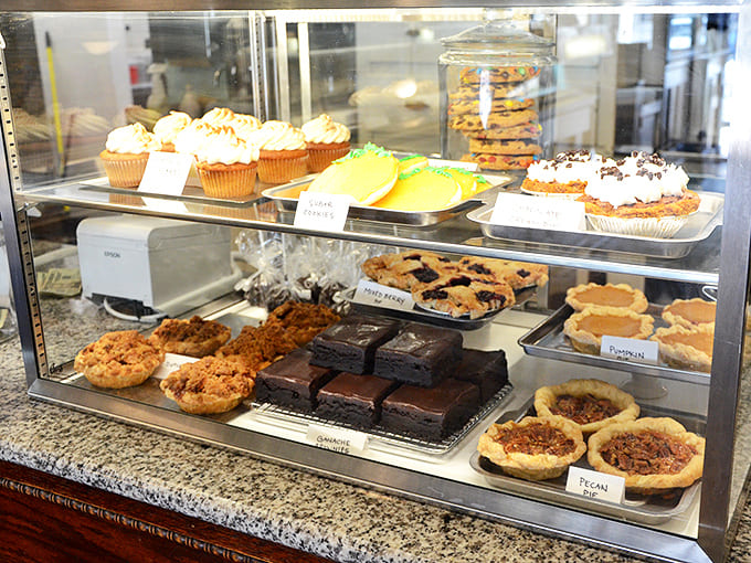 That display case is basically a glass monument to everything good about homemade desserts and skilled baking.