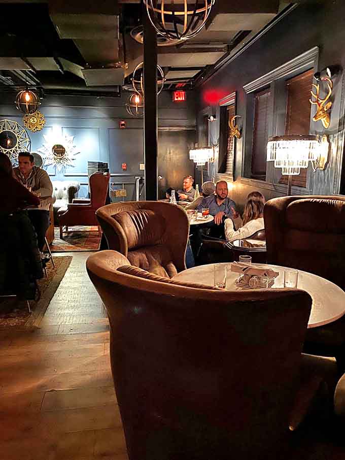 The lounge area invites intimate conversations, with comfortable seating arranged to create pockets of privacy within the communal space.