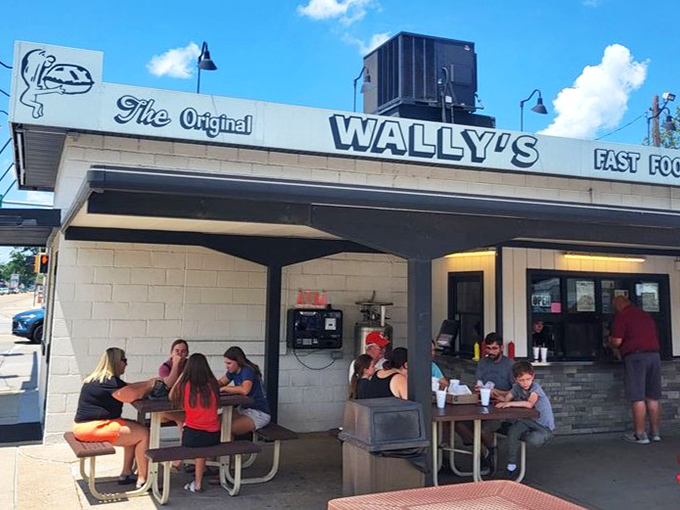 Outdoor tables fill with happy customers enjoying good food and sunshine at the original Wally&rsquo;s.