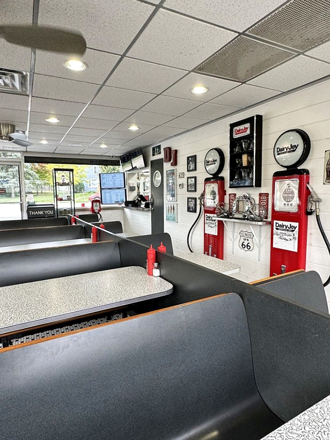 Black vinyl booths with mid-century lines invite you to slide in and stay awhile, surrounded by memorabilia from simpler times.