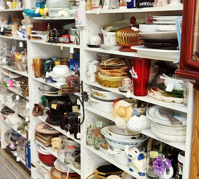 Dish paradise for collectors – shelves lined with vintage dinnerware offer everything from everyday Pyrex to special occasion serving pieces.